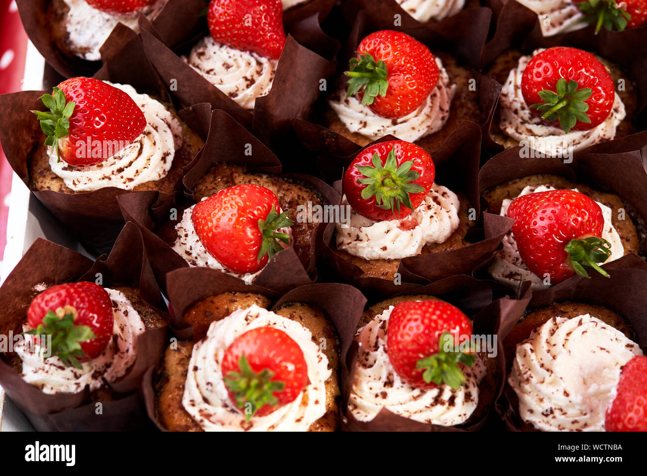 Photo of Strawberries and Cream muffin at a market stall Stock Photo ...