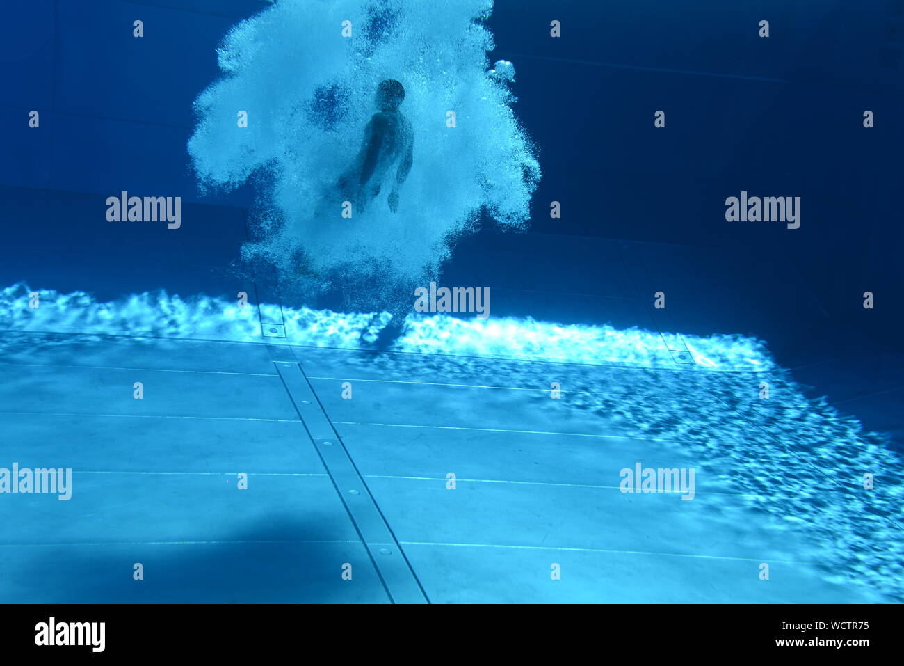 Man diving into pool hi-res stock photography and images - Alamy