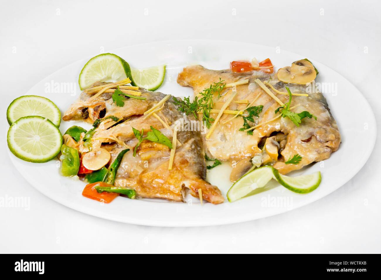 Pomfret fish pieces on plate, spicy Indian dish. Popular amongst ...