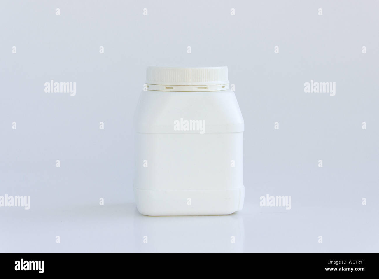 white plastic jar with lid on a white background Stock Photo - Alamy