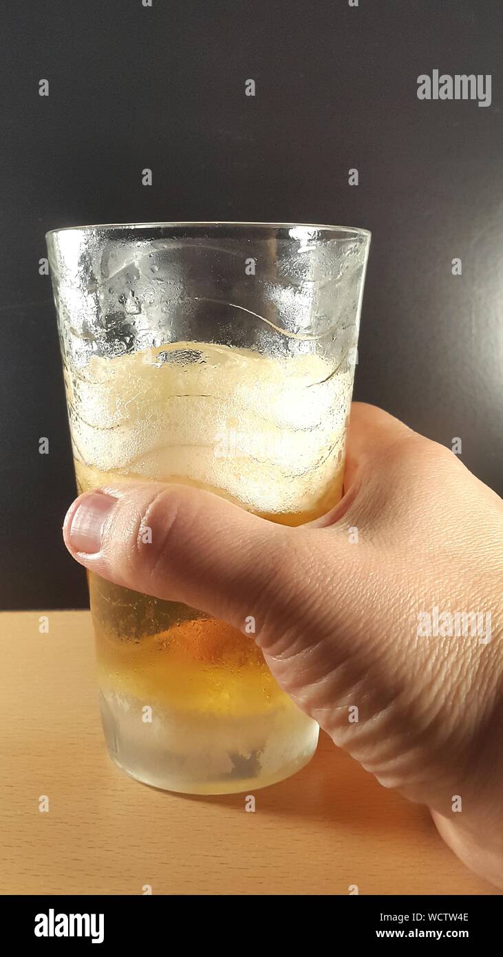 Man hand holding drink hi-res stock photography and images - Alamy