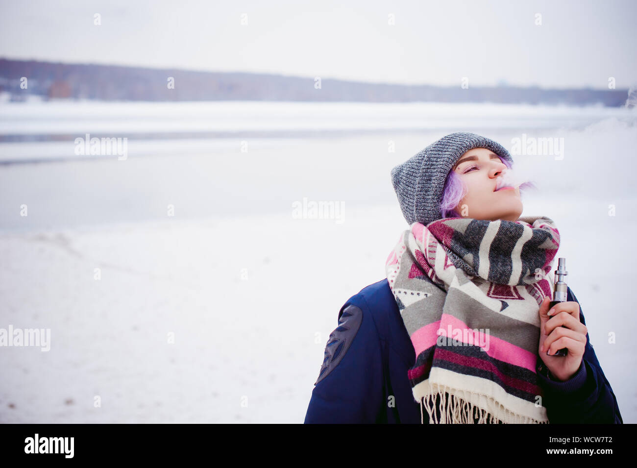 Woman smoking cigarette on beach hi-res stock photography and images ...