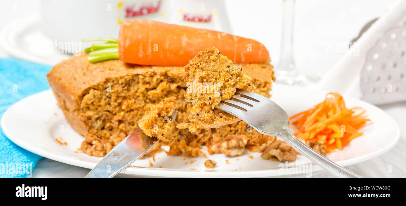 Eating a pice of Healthy Vegan Carrot Cake Loaf with Chopped spoon ...