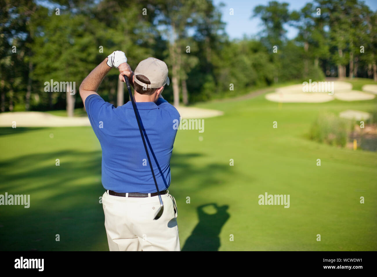 Playing golf hi-res stock photography and images - Alamy