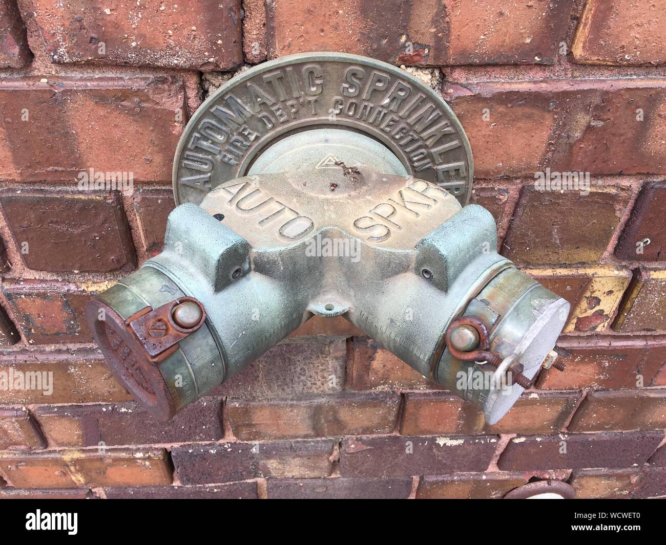Fire Hydrant On Wall High Resolution Stock Photography and Images - Alamy