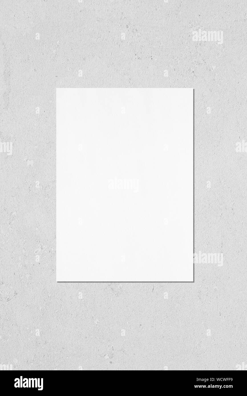 Empty white vertical rectangle poster mockup with soft shadow lying on ...