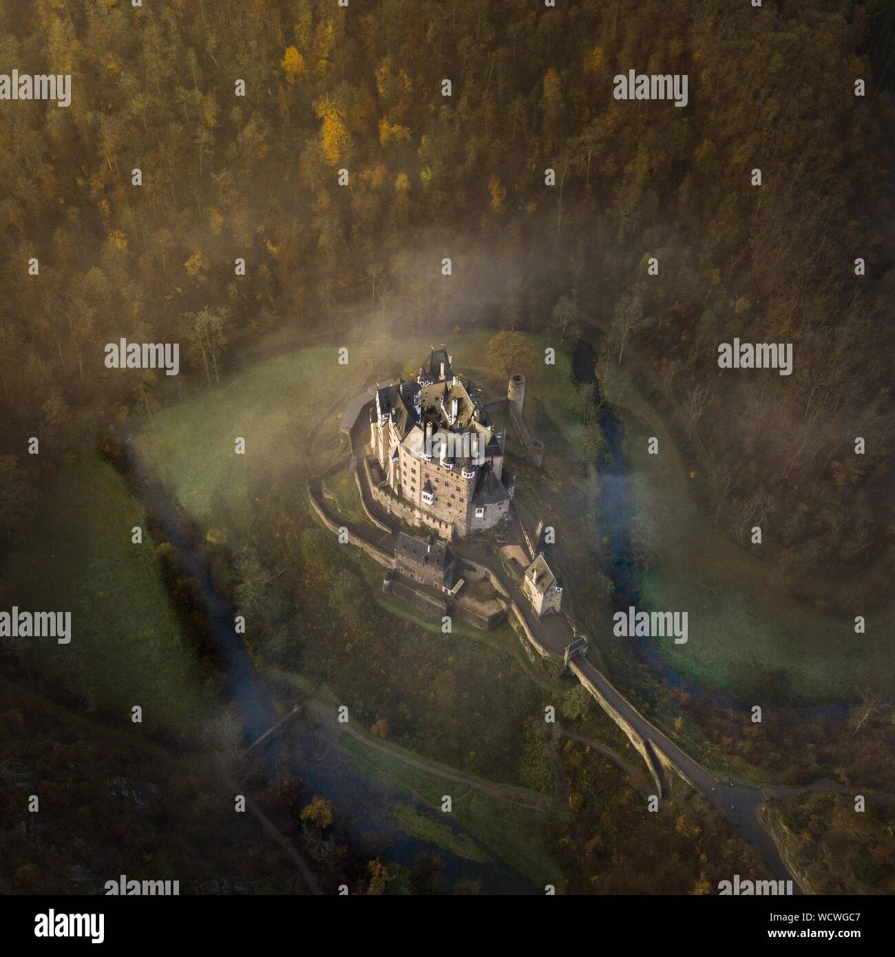 Aerial shot of the Eltz Castle surrounded by trees in Wierschem ...
