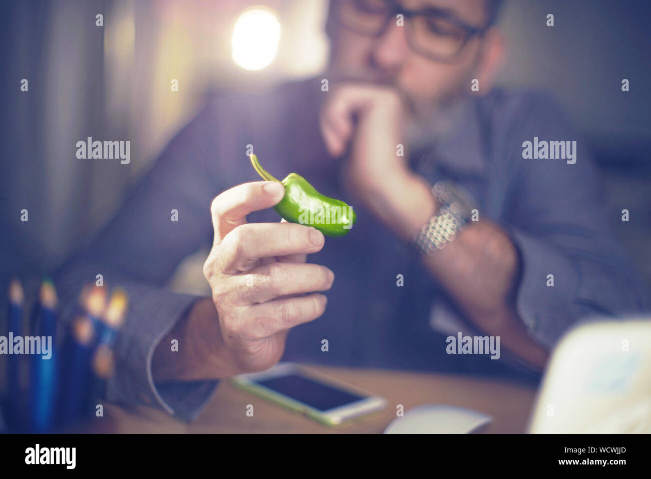 Man Eating Chili Pepper High Resolution Stock Photography and Images ...