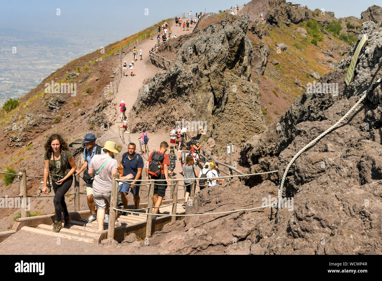 NAPLES, ITALY - AUGUST 2019: People walking and down steps on the path ...