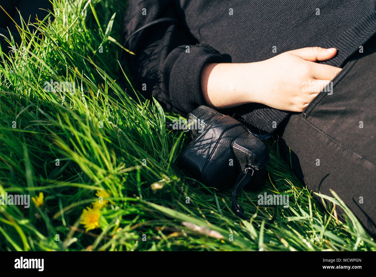 Person lying on the grass hi-res stock photography and images - Alamy