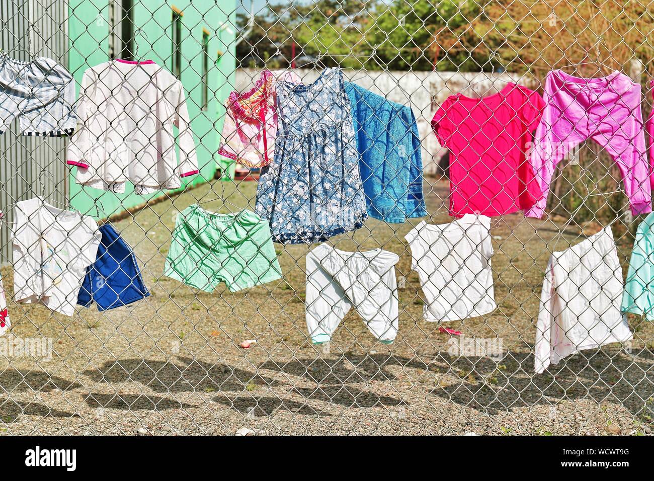 Laundry hanging on fence hi-res stock photography and images - Alamy