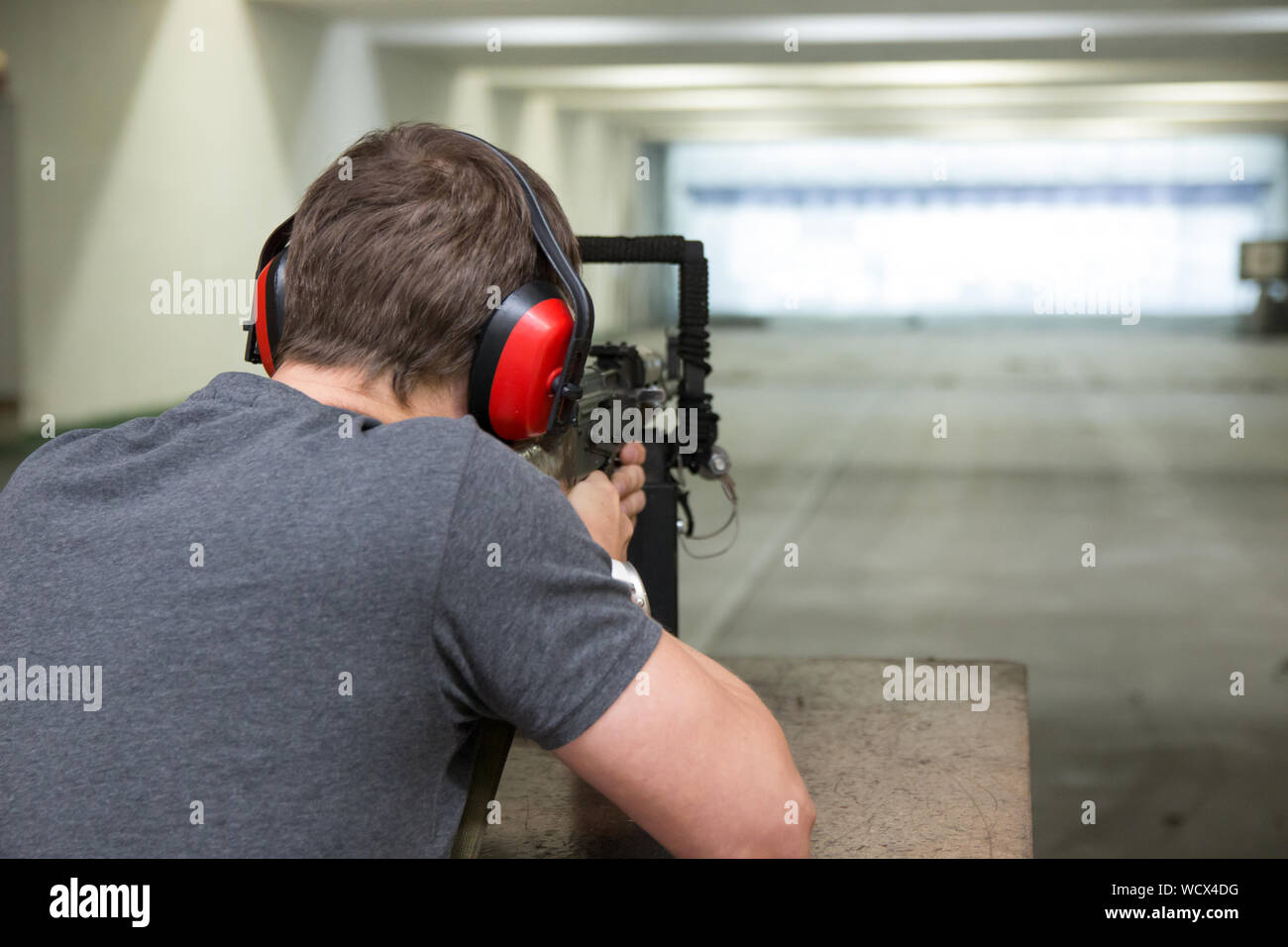Man aiming handgun rear view hi-res stock photography and images - Alamy