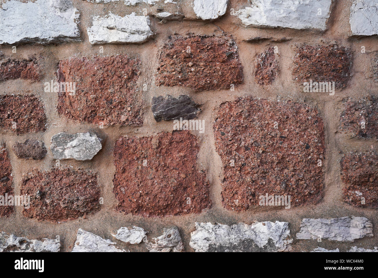 Part of a beautiful stone wall for background Stock Photo - Alamy