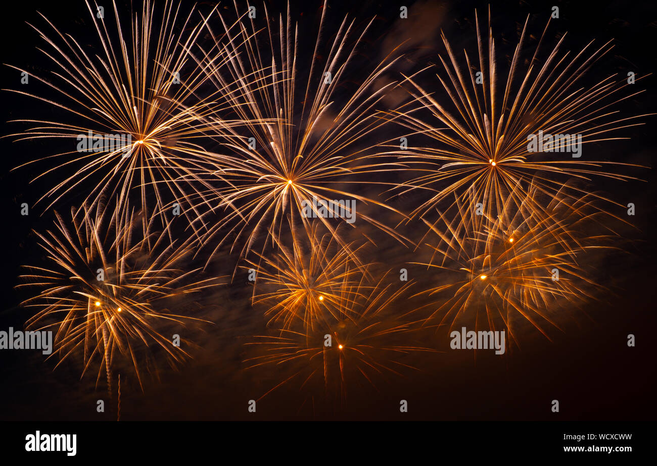Colorful fireworks in night sky background Stock Photo - Alamy
