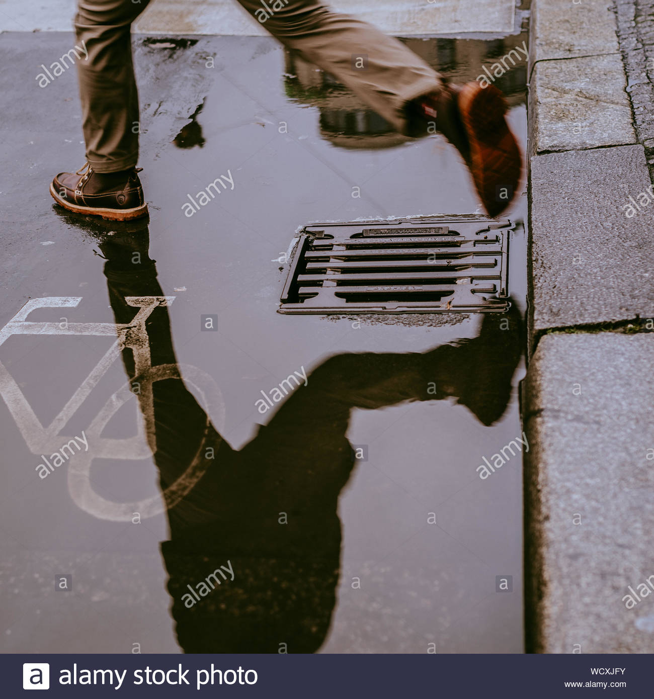 Jumping Over Puddle Stock Photos & Jumping Over Puddle Stock Images - Alamy