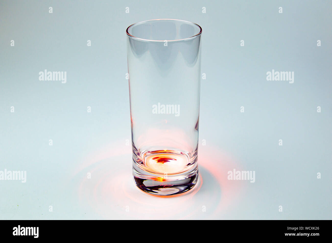 Empty glass transparent glass with color illumination. Background image ...