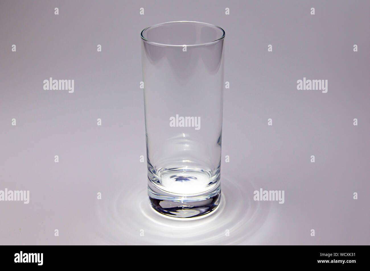 Empty glass transparent glass with color illumination. Background image ...