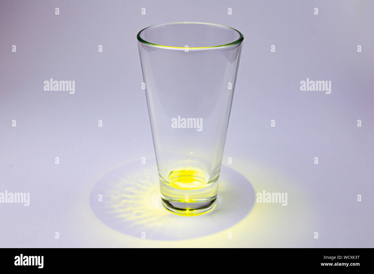 Empty glass transparent glass with color illumination. Background image ...