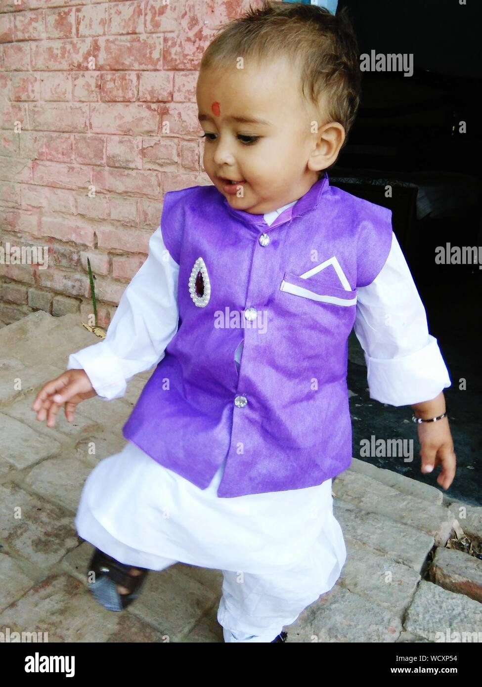 Boy standing outside house hi-res stock photography and images - Alamy