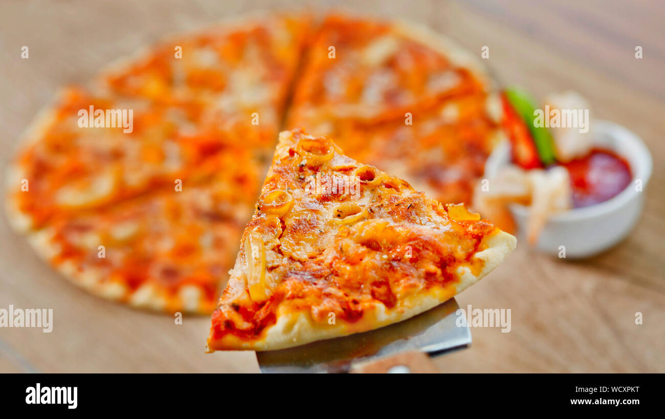 Classic Seafood Pizza with spicy chilli sauce Stock Photo - Alamy