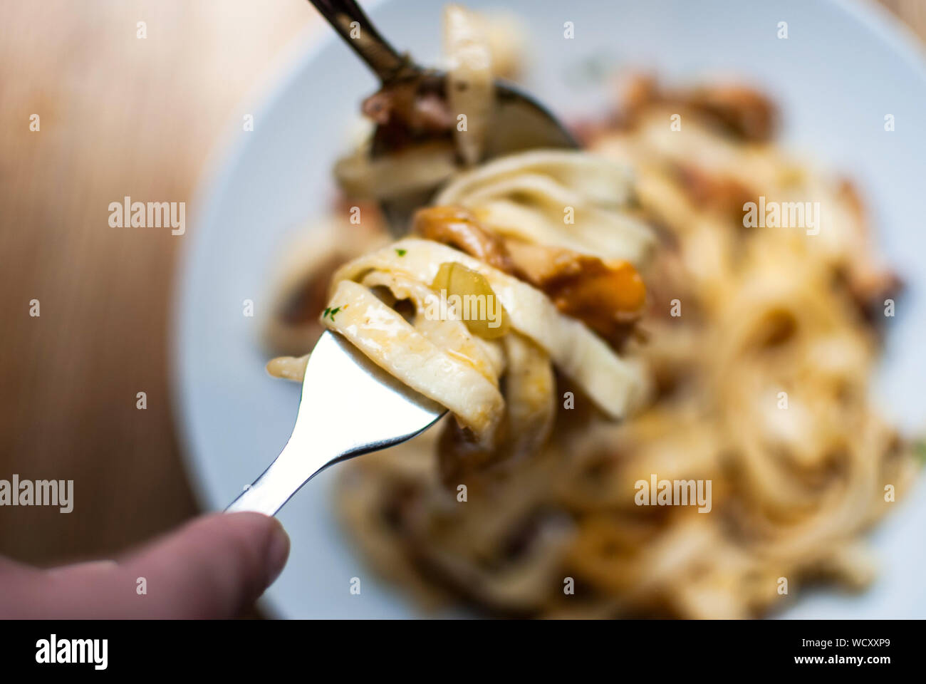 Human hand holding knife fork hi-res stock photography and images - Alamy