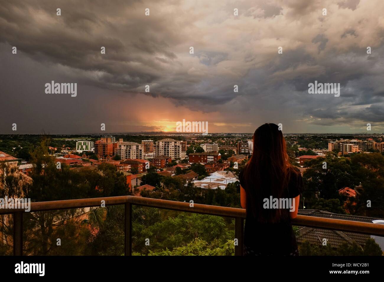 Woman overlooking town architecture hi-res stock photography and images ...