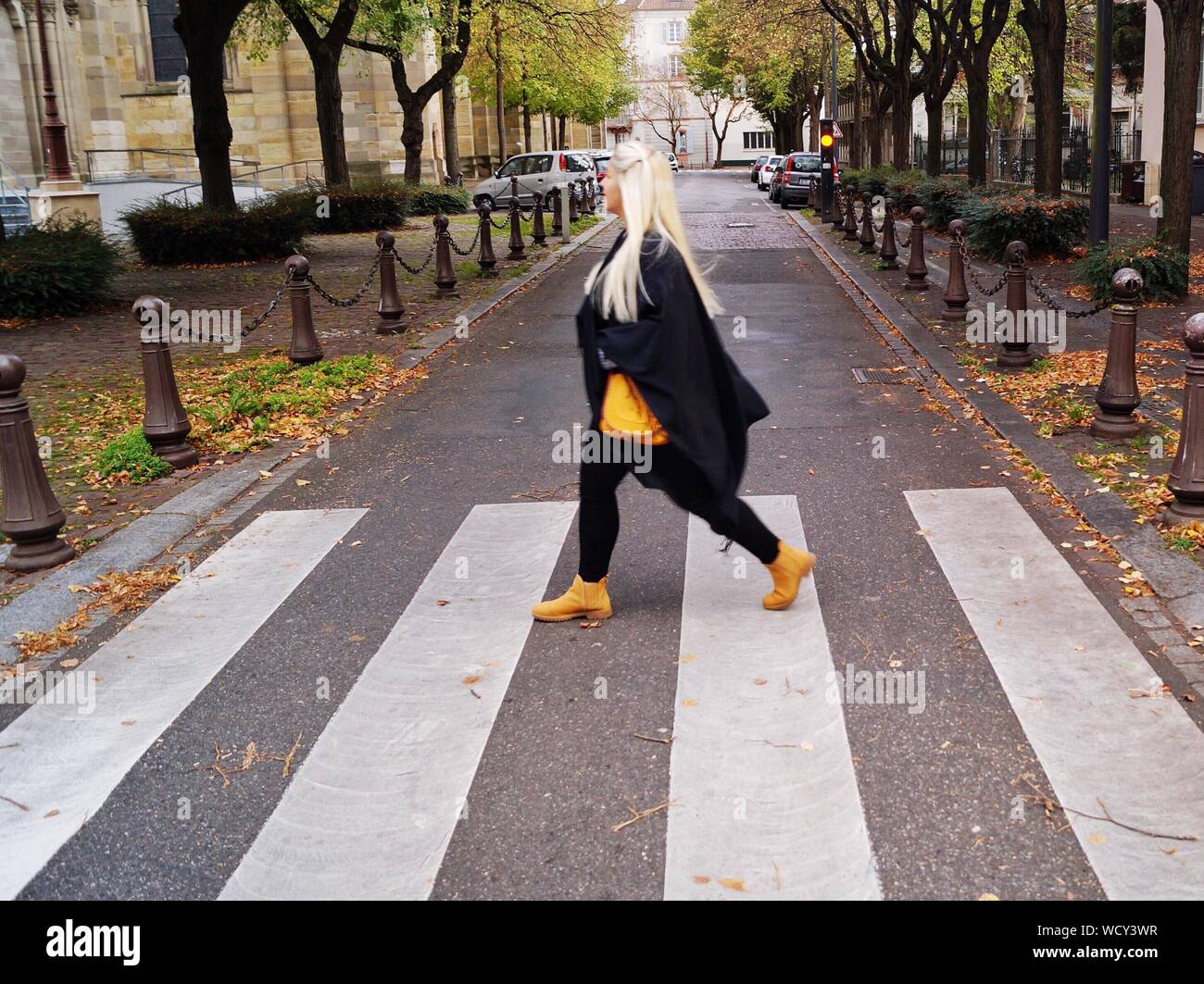 Woman crossing road hi-res stock photography and images - Alamy