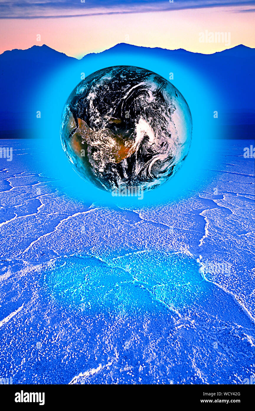 Futuristic view of a blue glowing earth floating over cracked blue salt ...