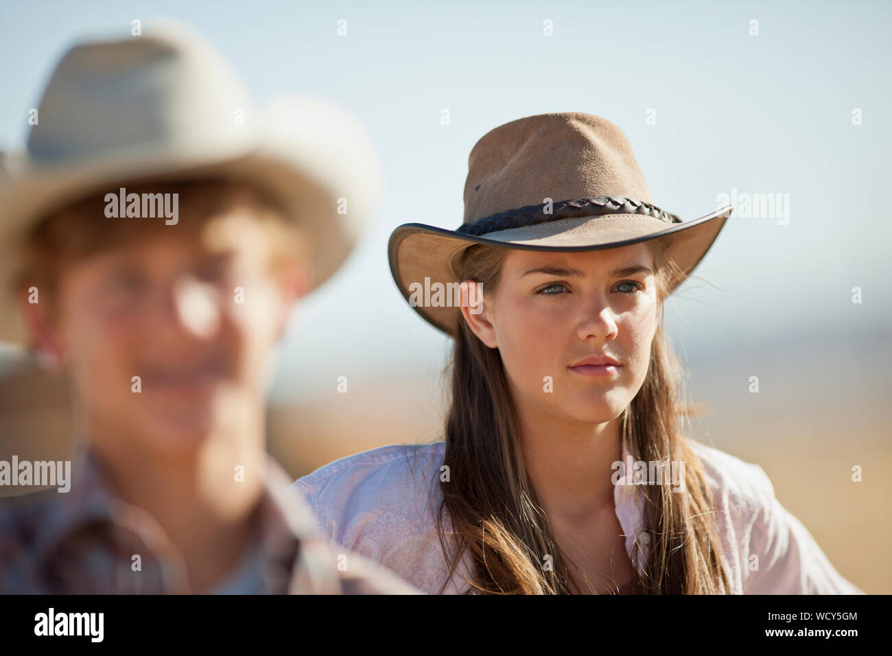 Teenage girl looking thoughtful at a ranch Stock Photo - Alamy