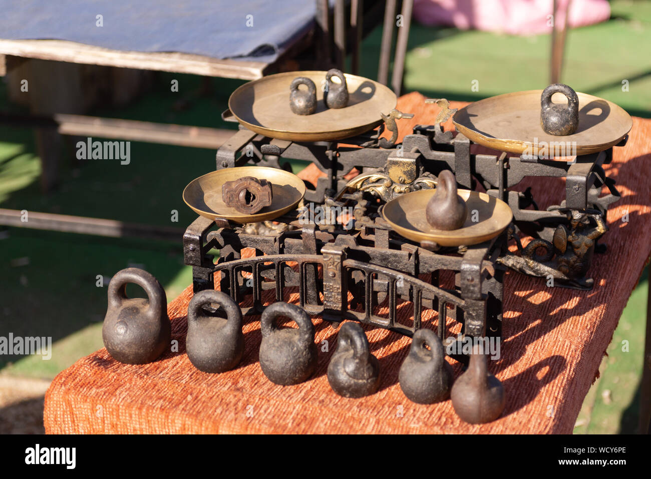 Flea market. Sale of old things. Old Soviet scales and a set of weights ...
