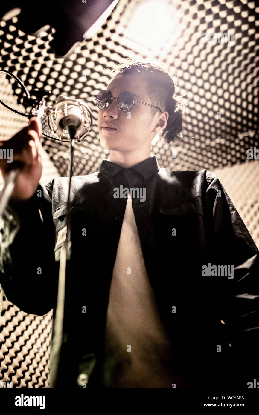 Man standing in studio singing hi-res stock photography and images - Alamy