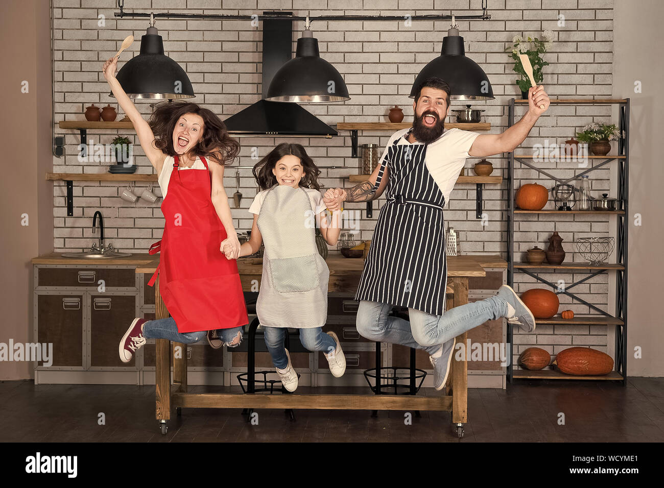 Family cuisine. Home interior. Culinary school. Happy family in kitchen ...