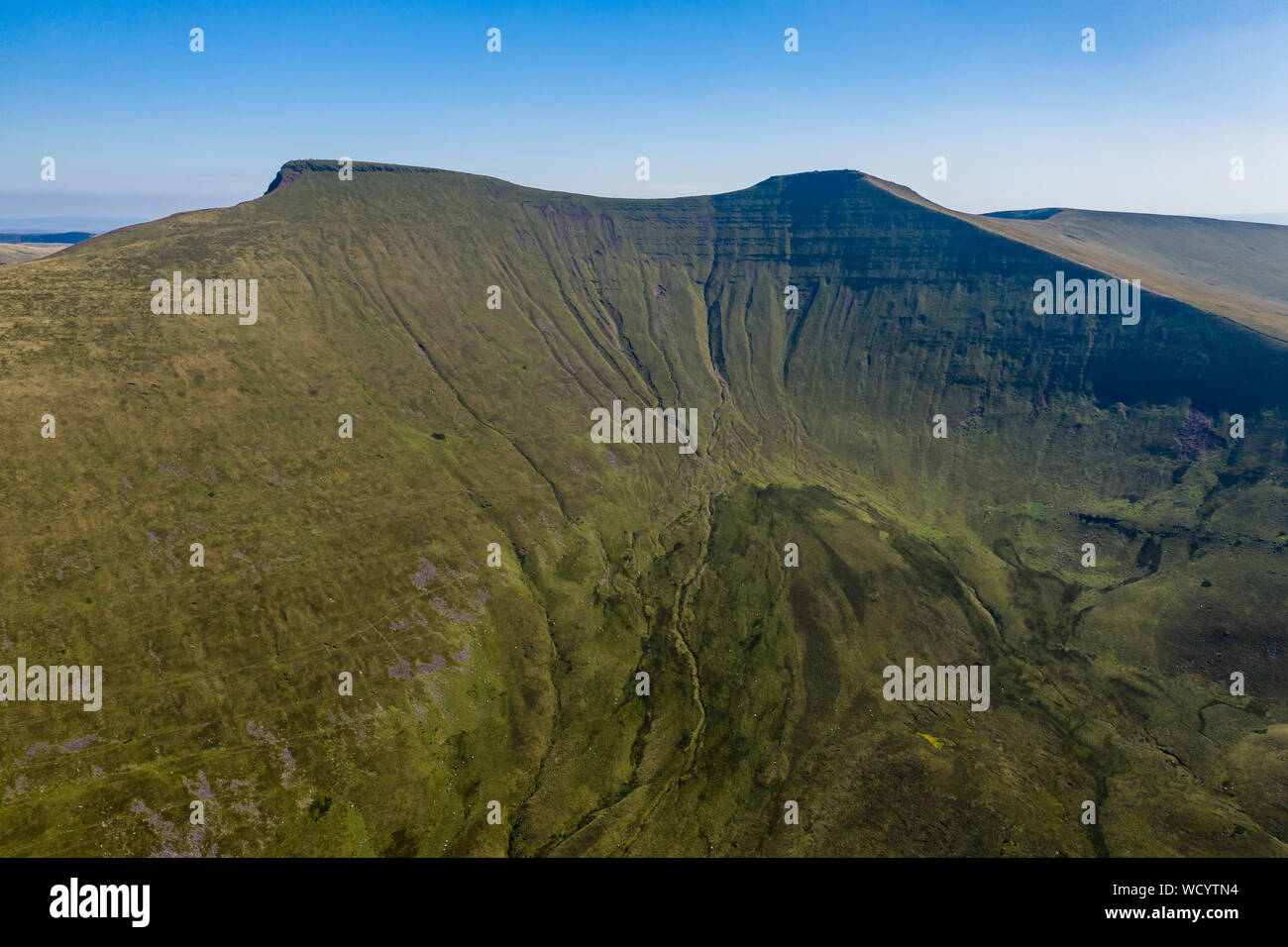 Aerial drone view of the twin peaks of mountains Corn Du and Pen-y-Fan ...