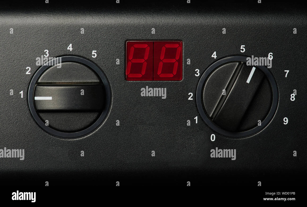 Two circle knobs with digital display panel on metal background Stock ...