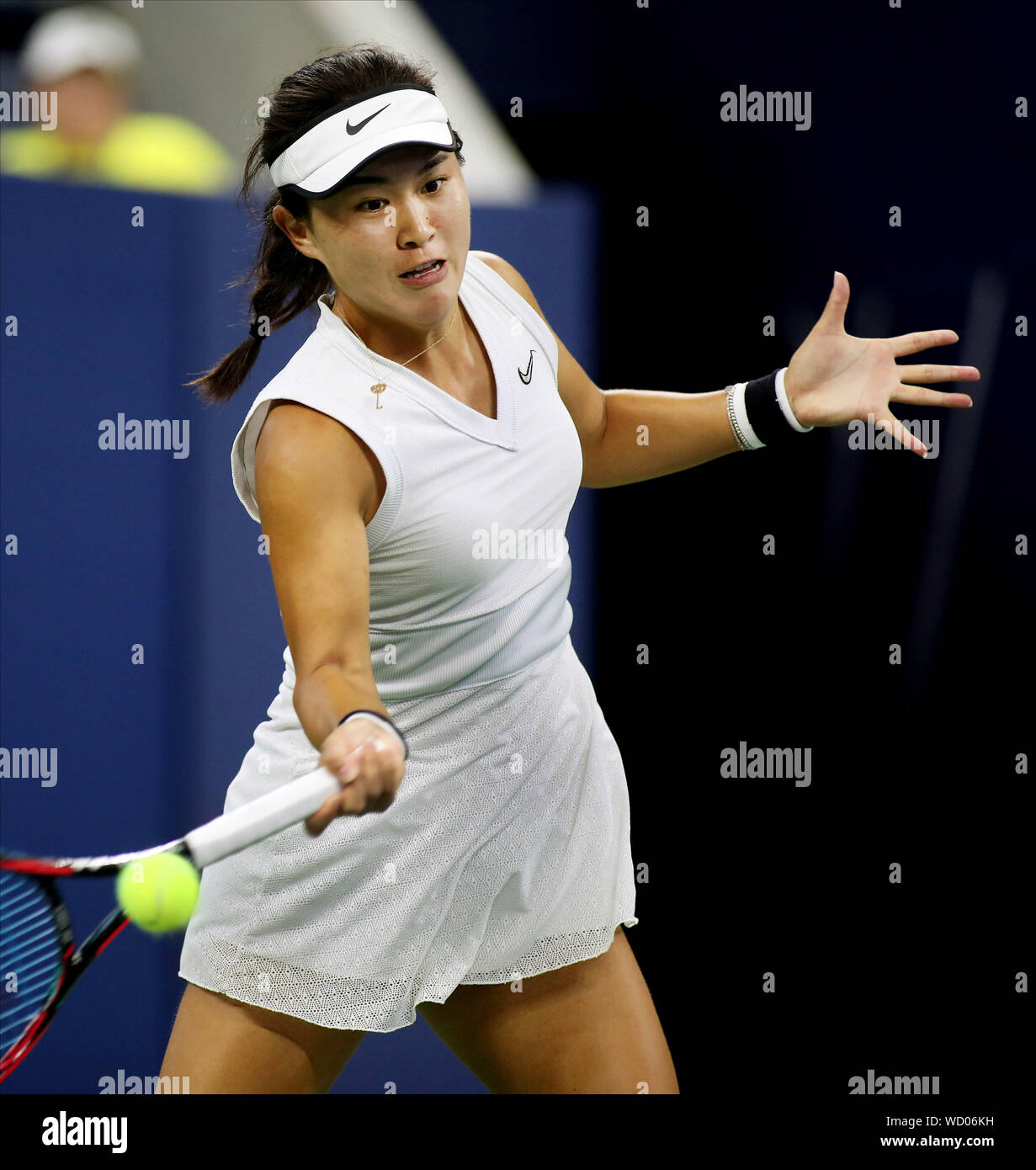 Lin Zhu of China hits a forehand to Madison Keys of the USA in the ...