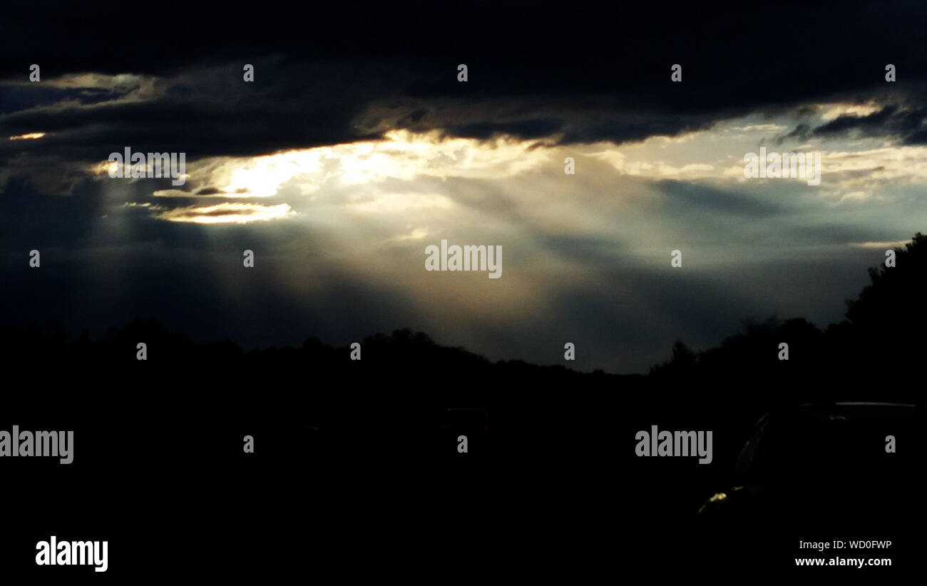 Sunlight and dark clouds hi-res stock photography and images - Alamy