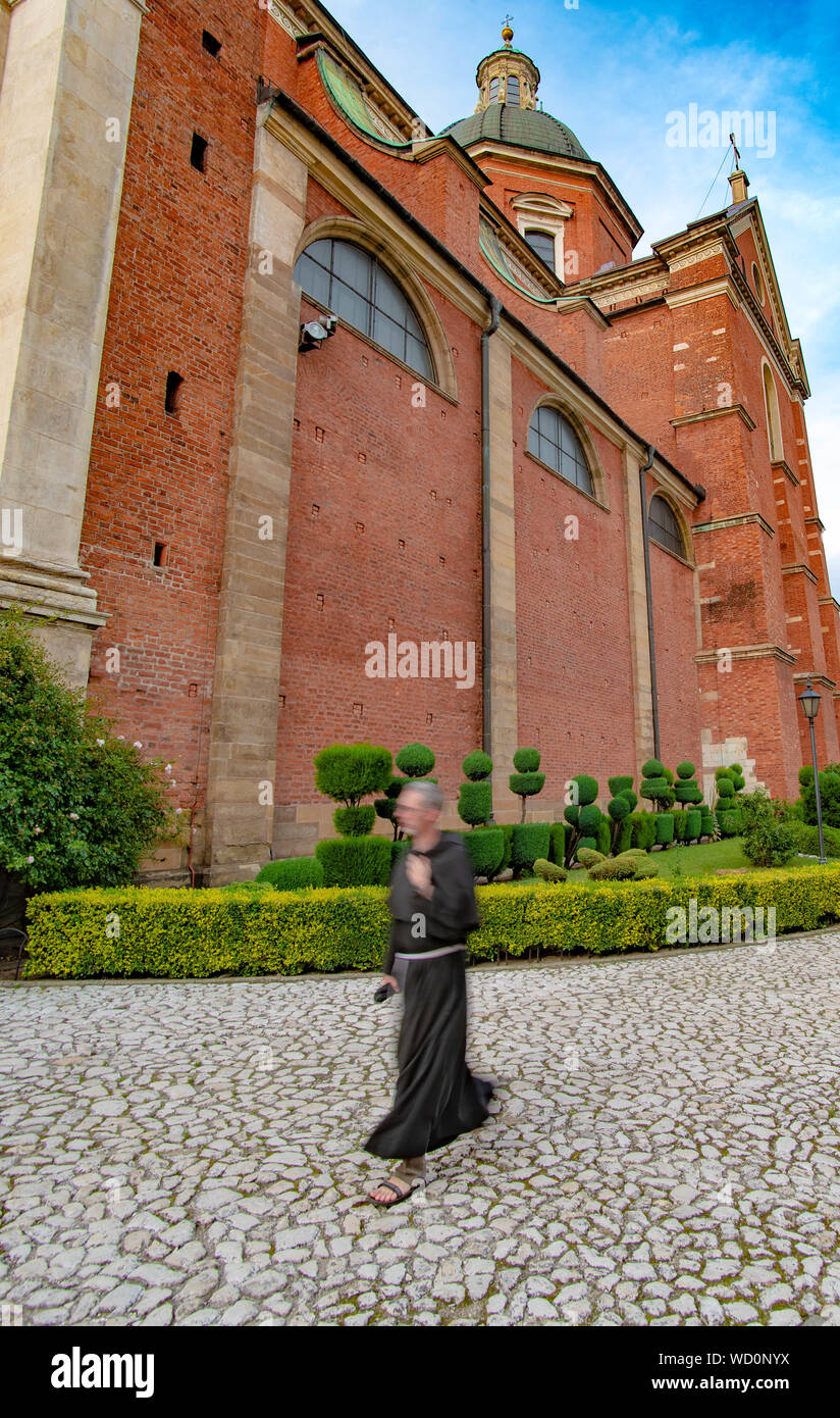 Priest walking near church in Krakow, Poland Stock Photo - Alamy