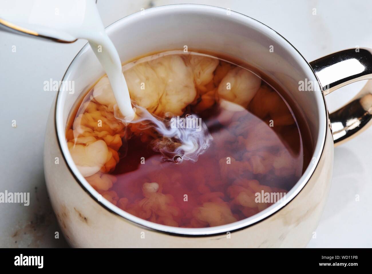 Cream pouring tea hi-res stock photography and images - Alamy