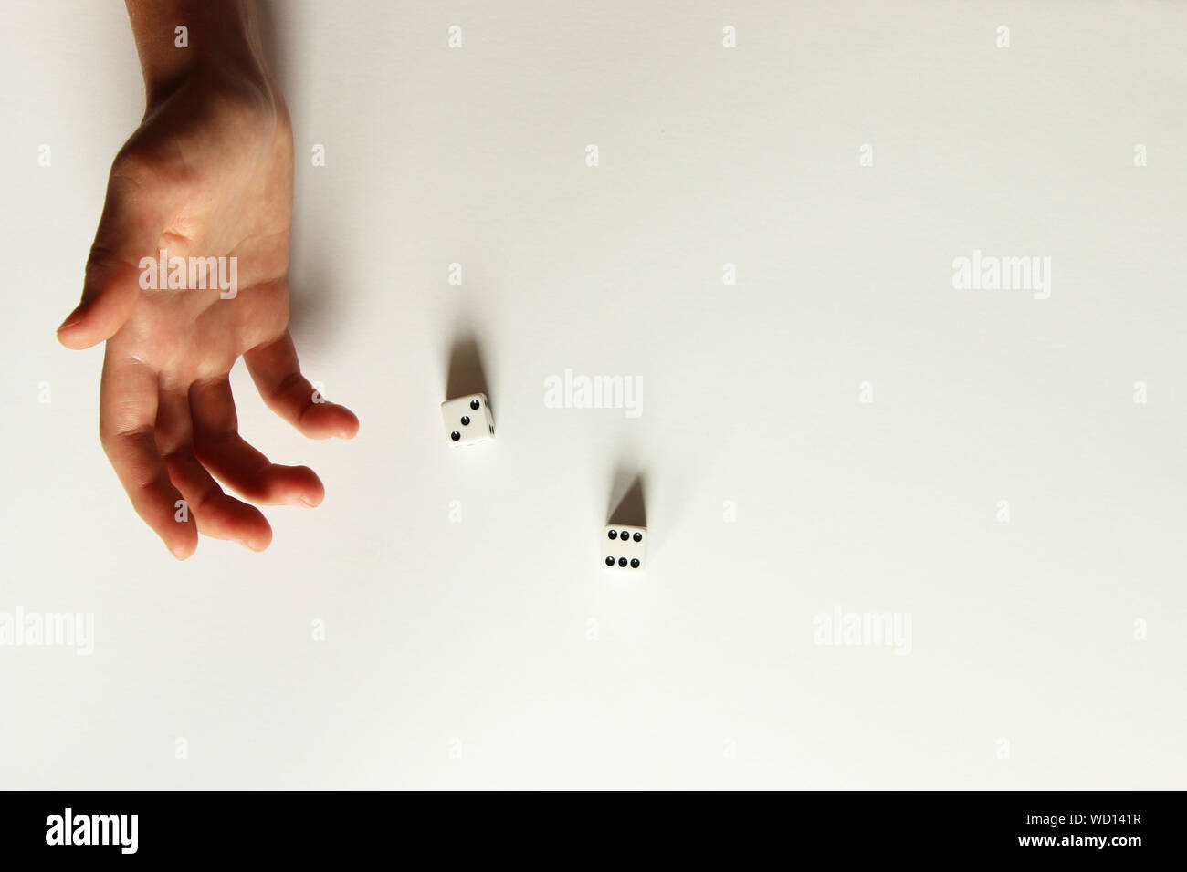 Man holding one dice hi-res stock photography and images - Alamy