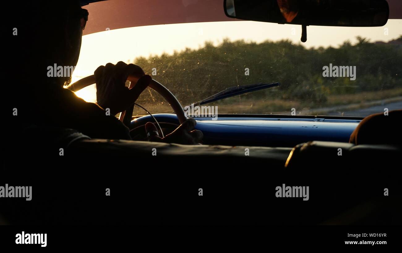 Driving into sunset hi-res stock photography and images - Alamy