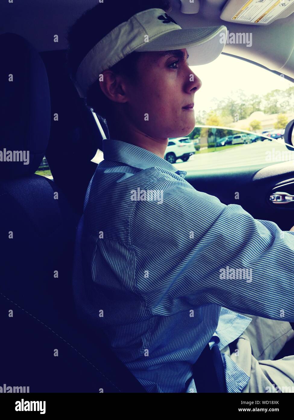 Young man driving car hi-res stock photography and images - Alamy
