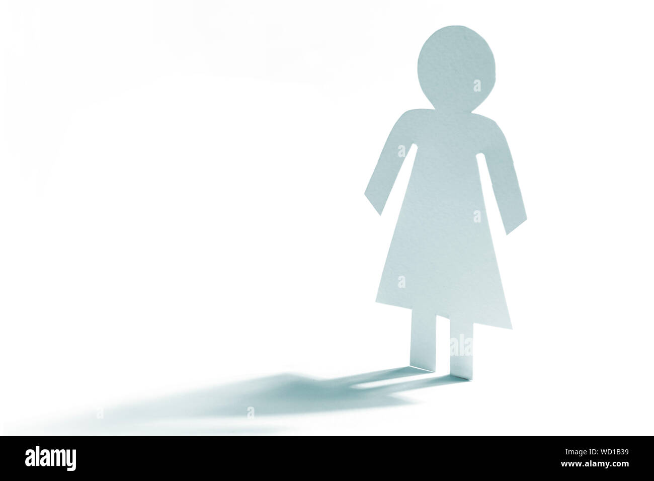 Close-up Of Female Paper Symbol Against White Background Stock Photo ...
