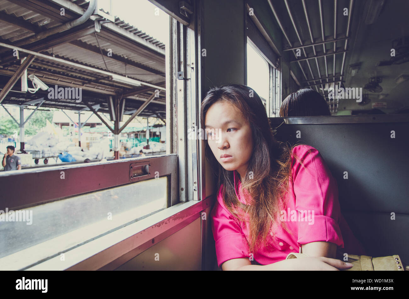 Woman public transport sad hi-res stock photography and images - Alamy