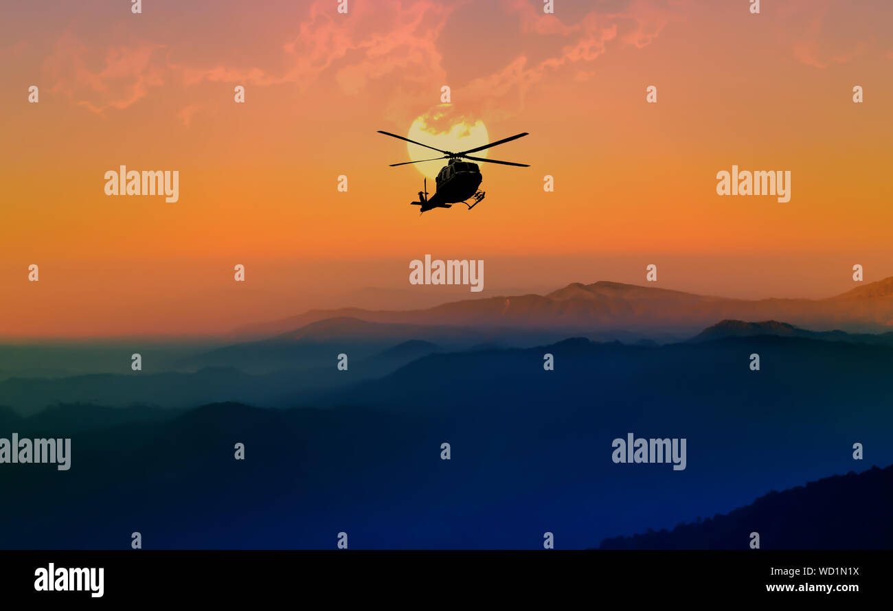 Helicopter flying over mountains hi-res stock photography and images ...