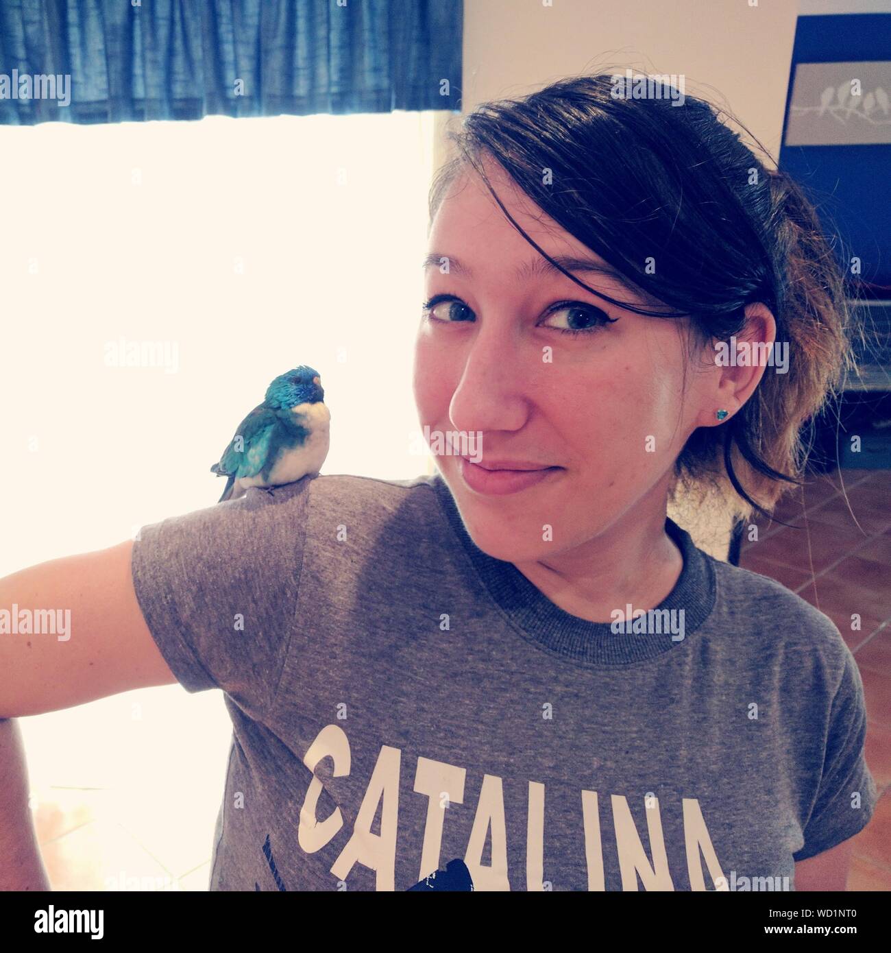 Woman and bird hi-res stock photography and images - Alamy