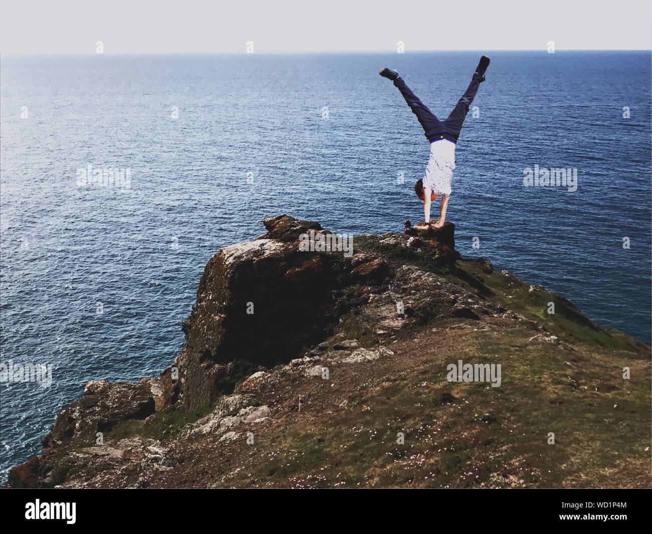 Doing handstand in sea hi-res stock photography and images - Alamy
