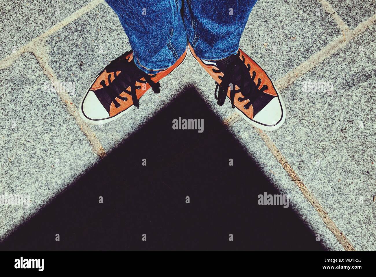 Man standing on pavement hi-res stock photography and images - Alamy