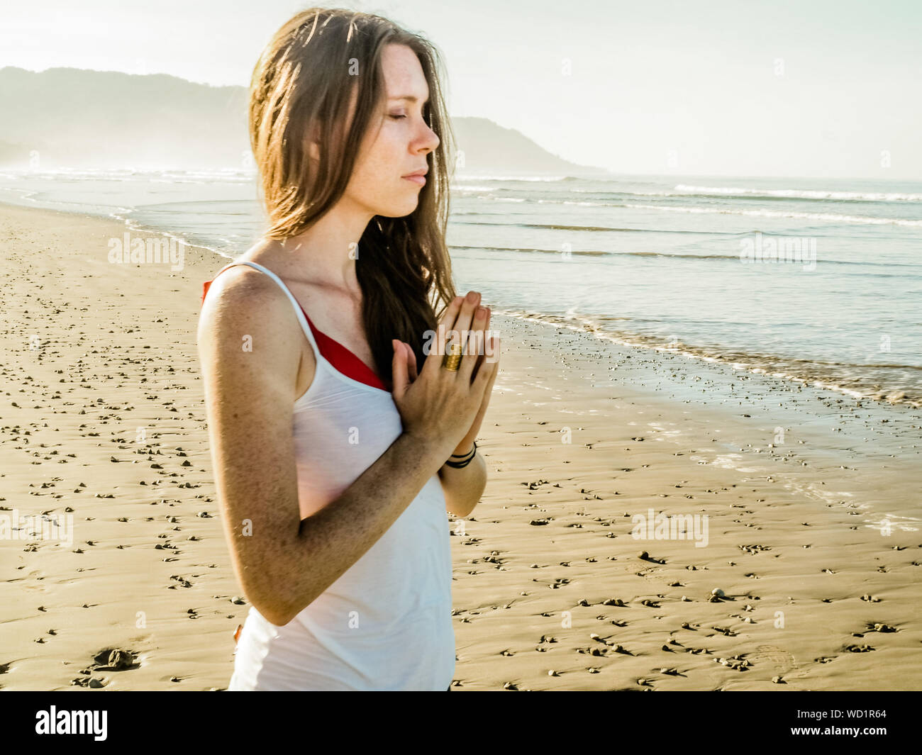 Women praying in water hi-res stock photography and images - Alamy