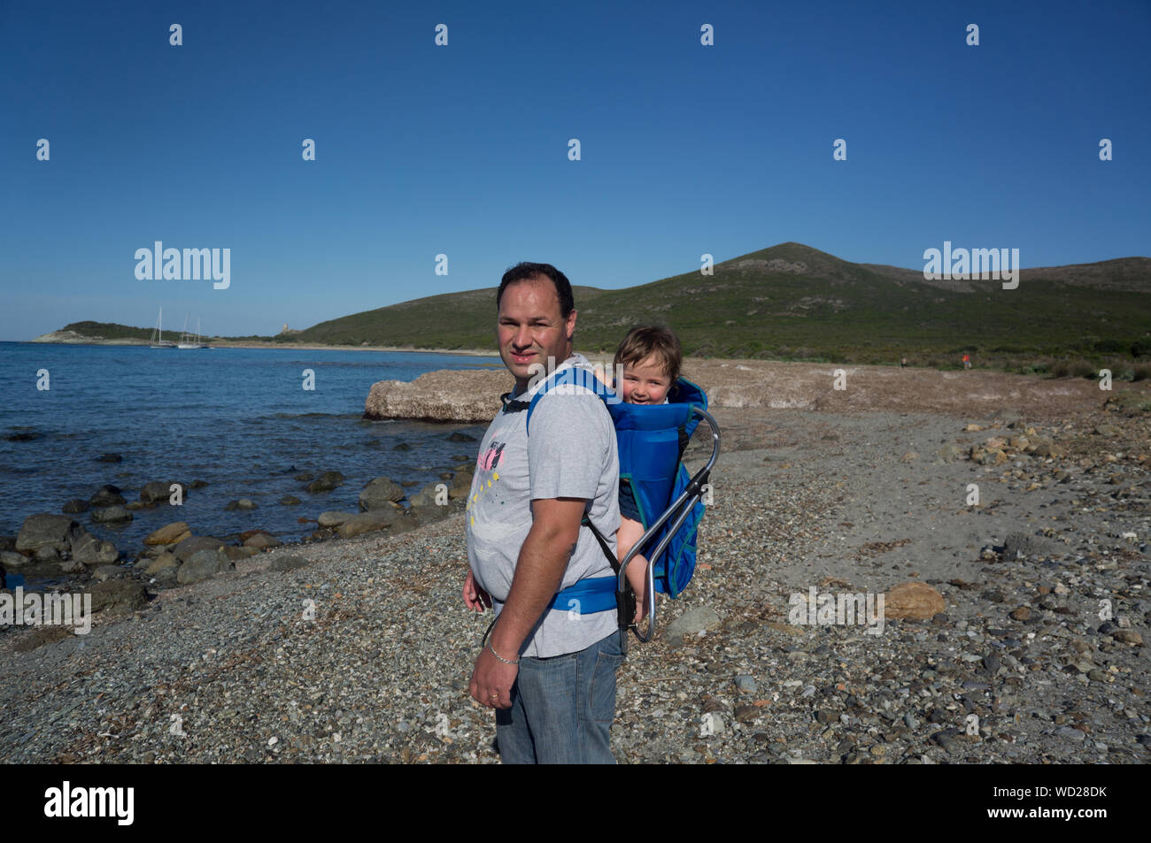 Man carrying boy hi-res stock photography and images - Alamy