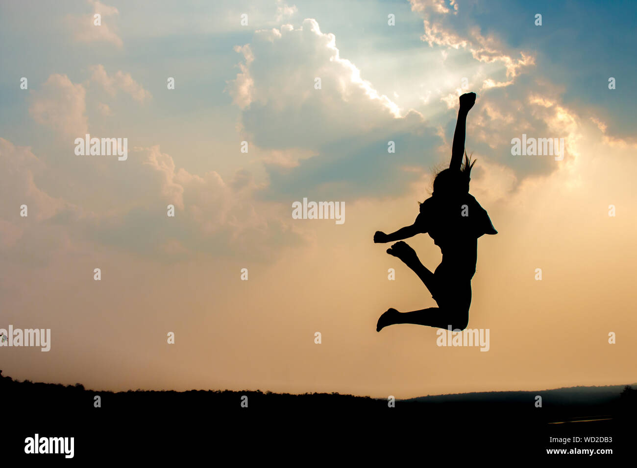 Women sunset jumping hi-res stock photography and images - Alamy